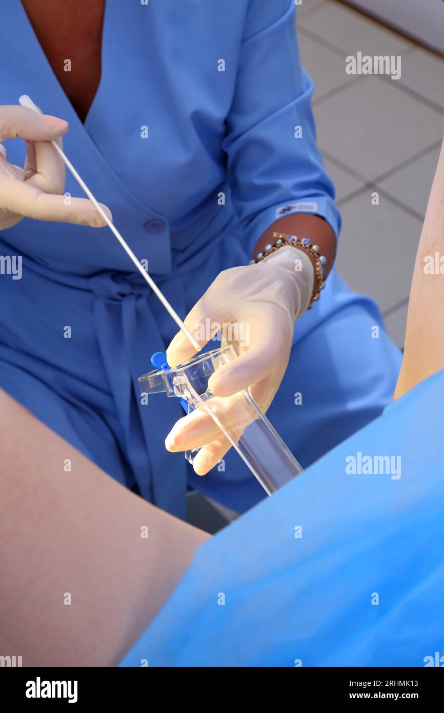 Pipelle biopsy procedure. The gynecologist performs a pipelle biopsy ...