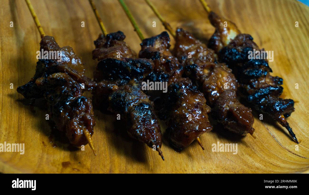 Chicken satay on bamboo skewer hi-res stock photography and images - Alamy