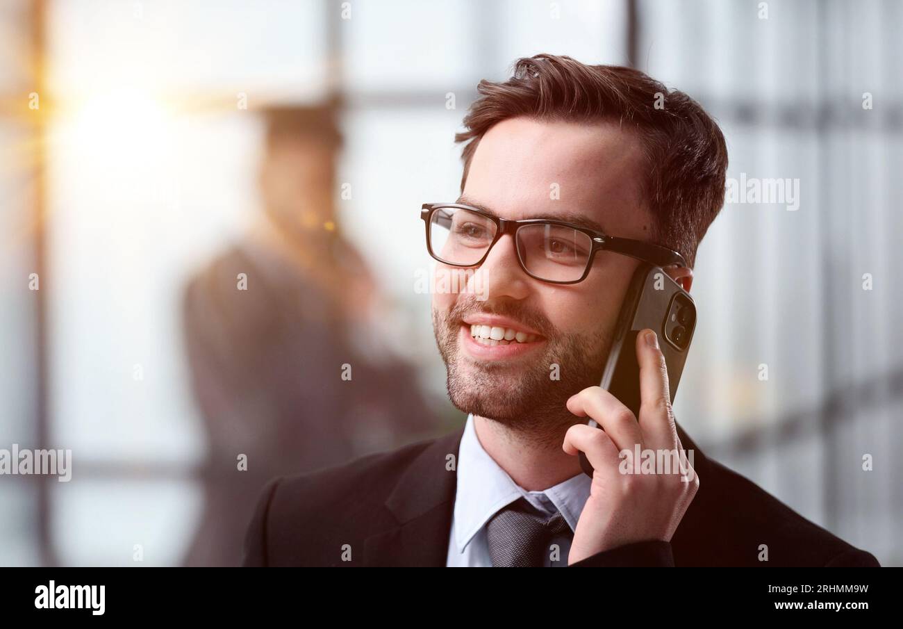 Close-up of a man in an office building talking on the phone Stock ...
