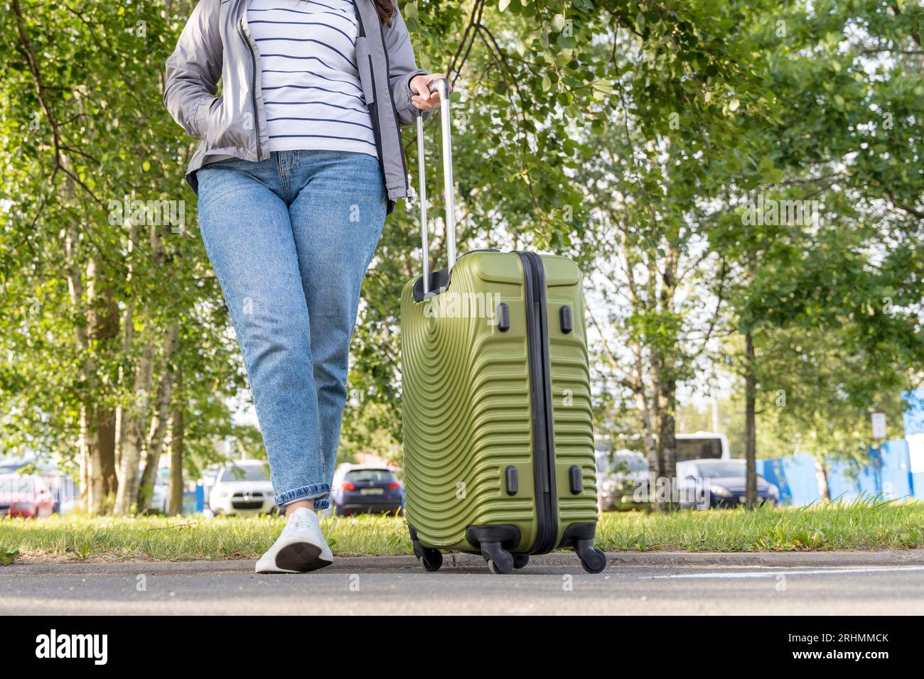 Woman sitting on curb waiting hi-res stock photography and images - Alamy