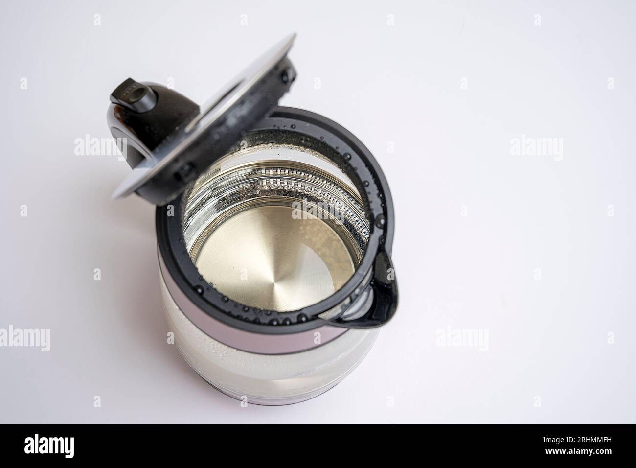 new glass electric kettle with open lid on white background, top view ...