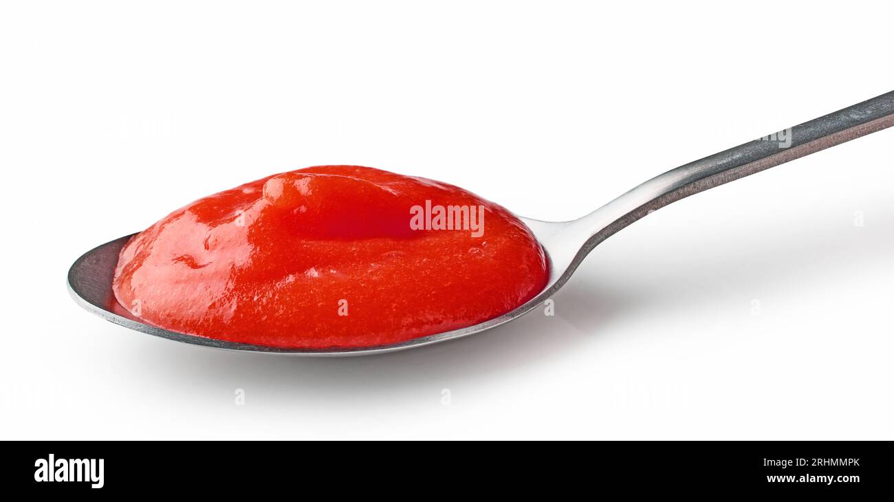 tomato ketchup puree in a spoon isolated on white background Stock ...