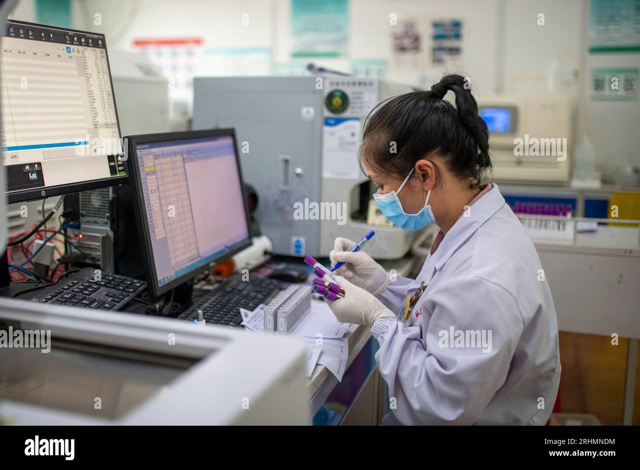 Doctors consult on X-rays in Qiandongnan, Guizhou province, China ...