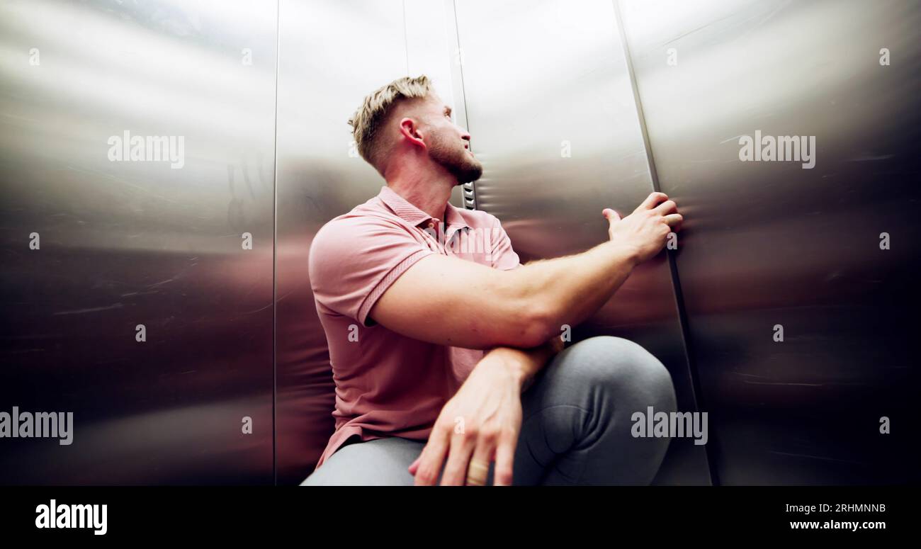 Man Suffering From Claustrophobia Trapped Inside Elevator Screaming ...