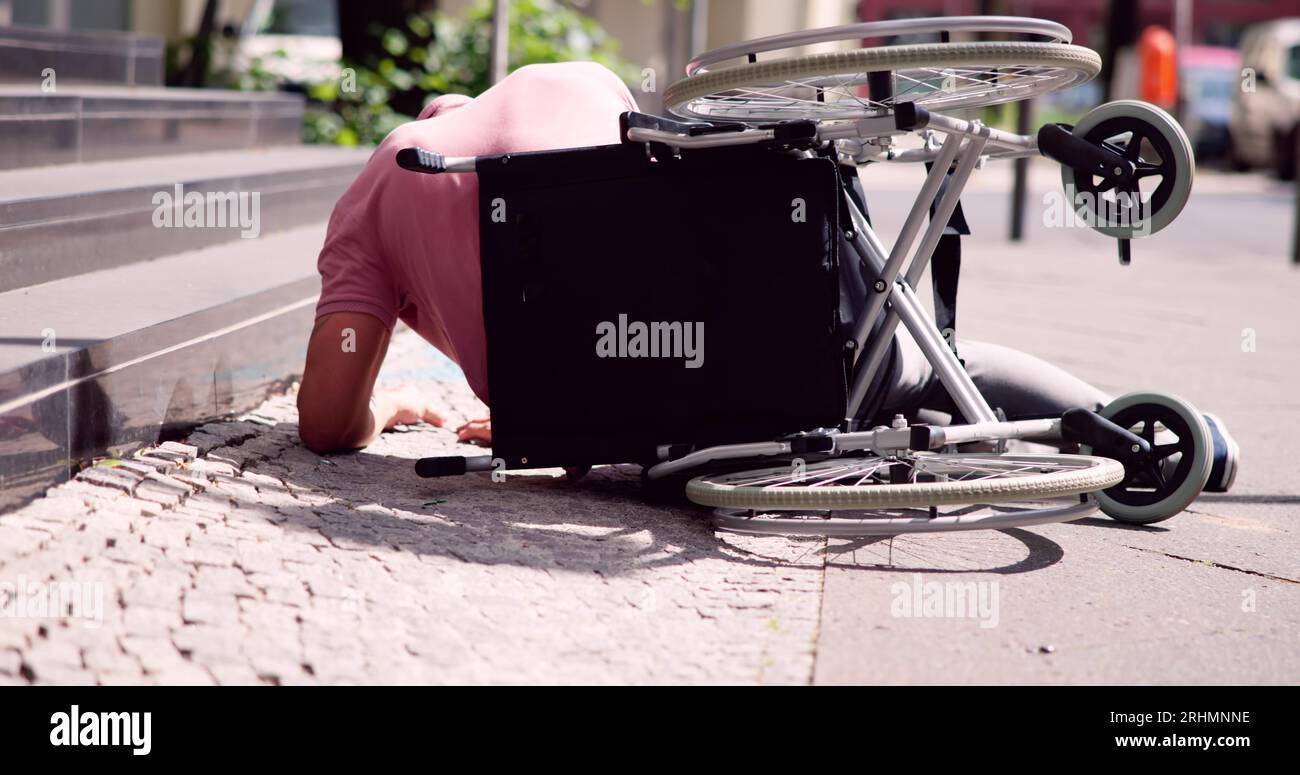 Wheelchair Fall Accident. Sad Man In Pain Stock Photo - Alamy