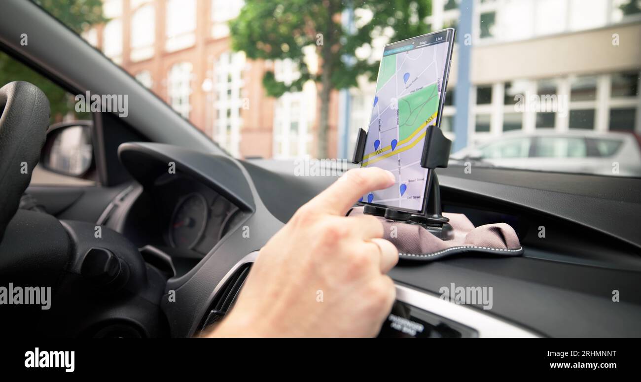 Car With GPS Navigation Maps On Mobile Phone Touchscreen Stock Photo ...