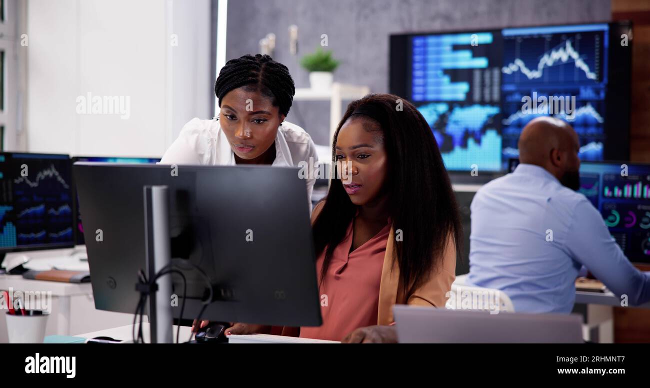 African Financial Data Analysts Using Performance Dashboard On Screens ...