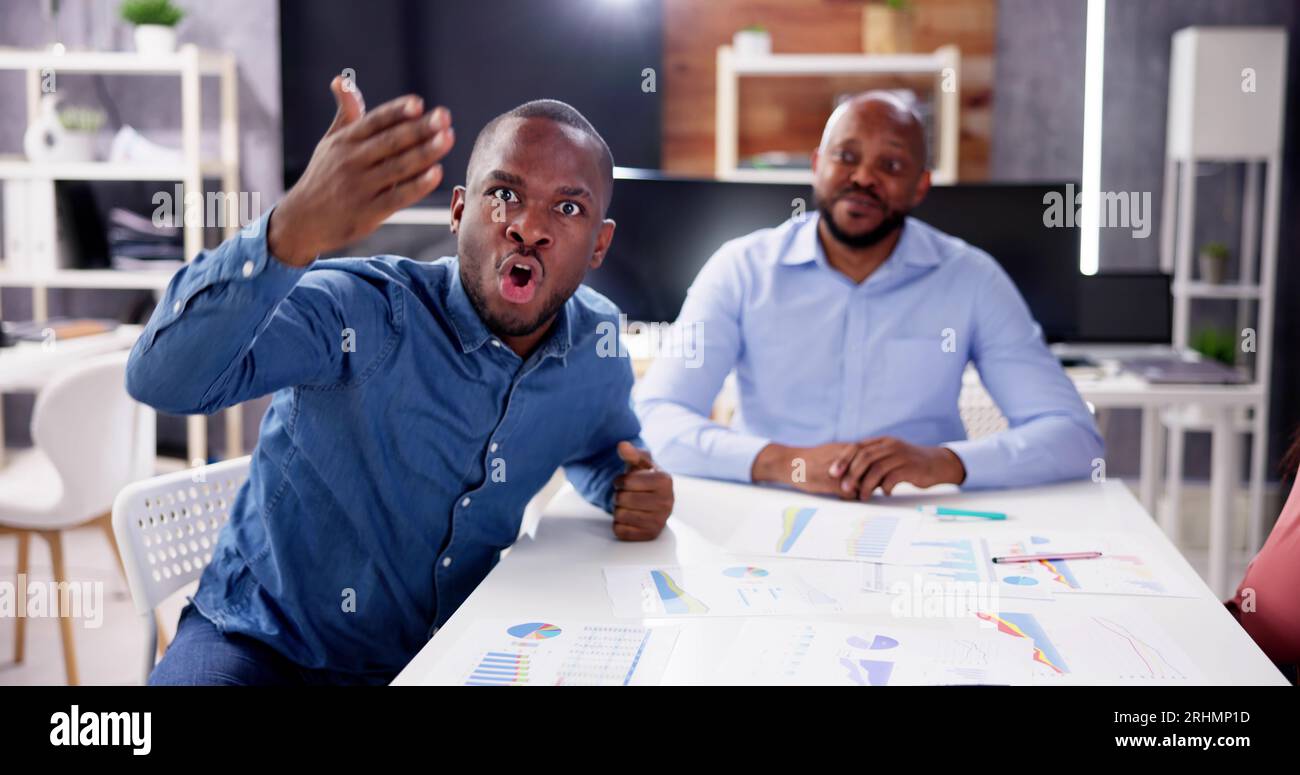 Workplace Quarrel. Angry Looking Man Looking In Camera Stock Photo - Alamy