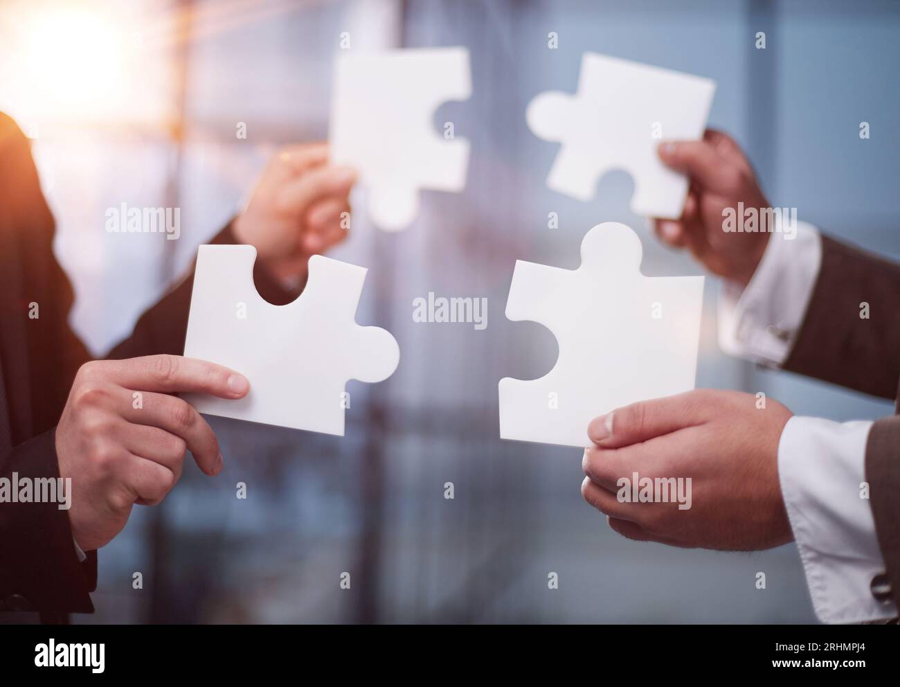 Working together to put things together. two unrecognizable ...