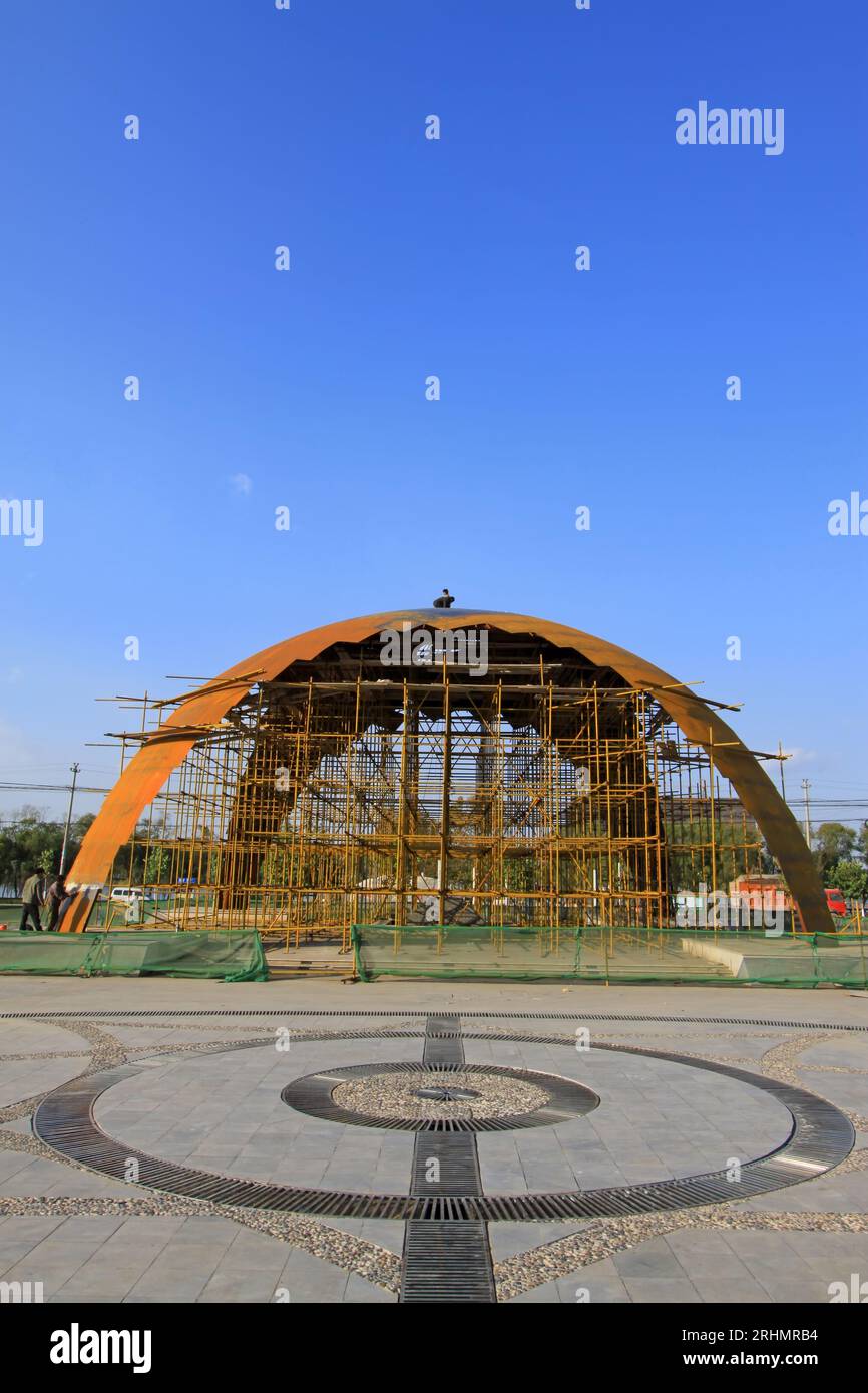 unfinished metal buildings in the square, in a park Stock Photo - Alamy