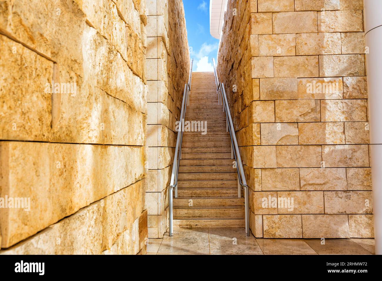 Steps within a narrow passage nestled between walls leading toward the ...