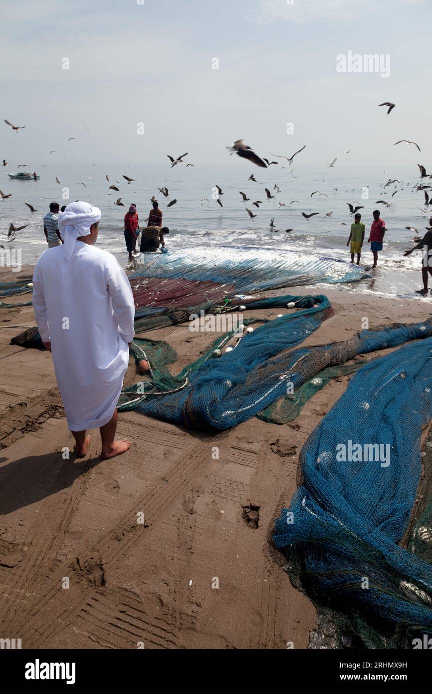 Fishing with net beach hi-res stock photography and images - Alamy