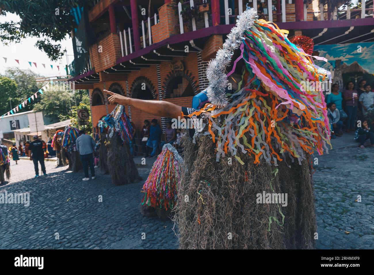 Multicolored parade of individuals from indigenous communities, at a ...