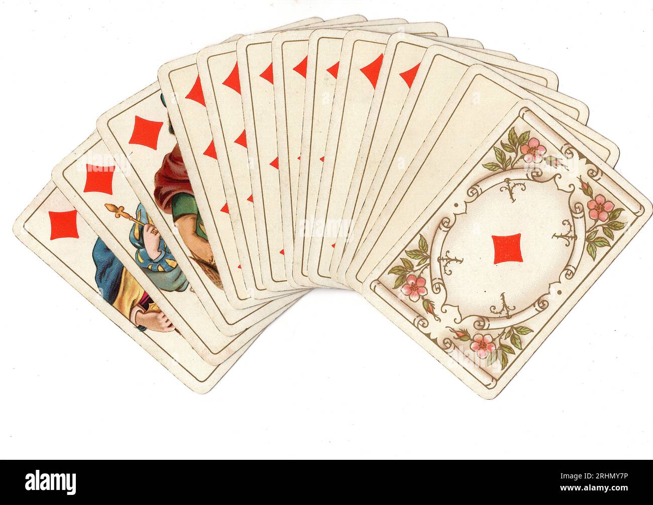 Antique playing cards featuring a full suit of diamonds of spades on a ...