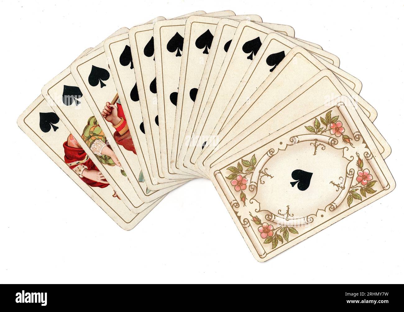 Antique playing cards featuring a full suit of spades on a white ...
