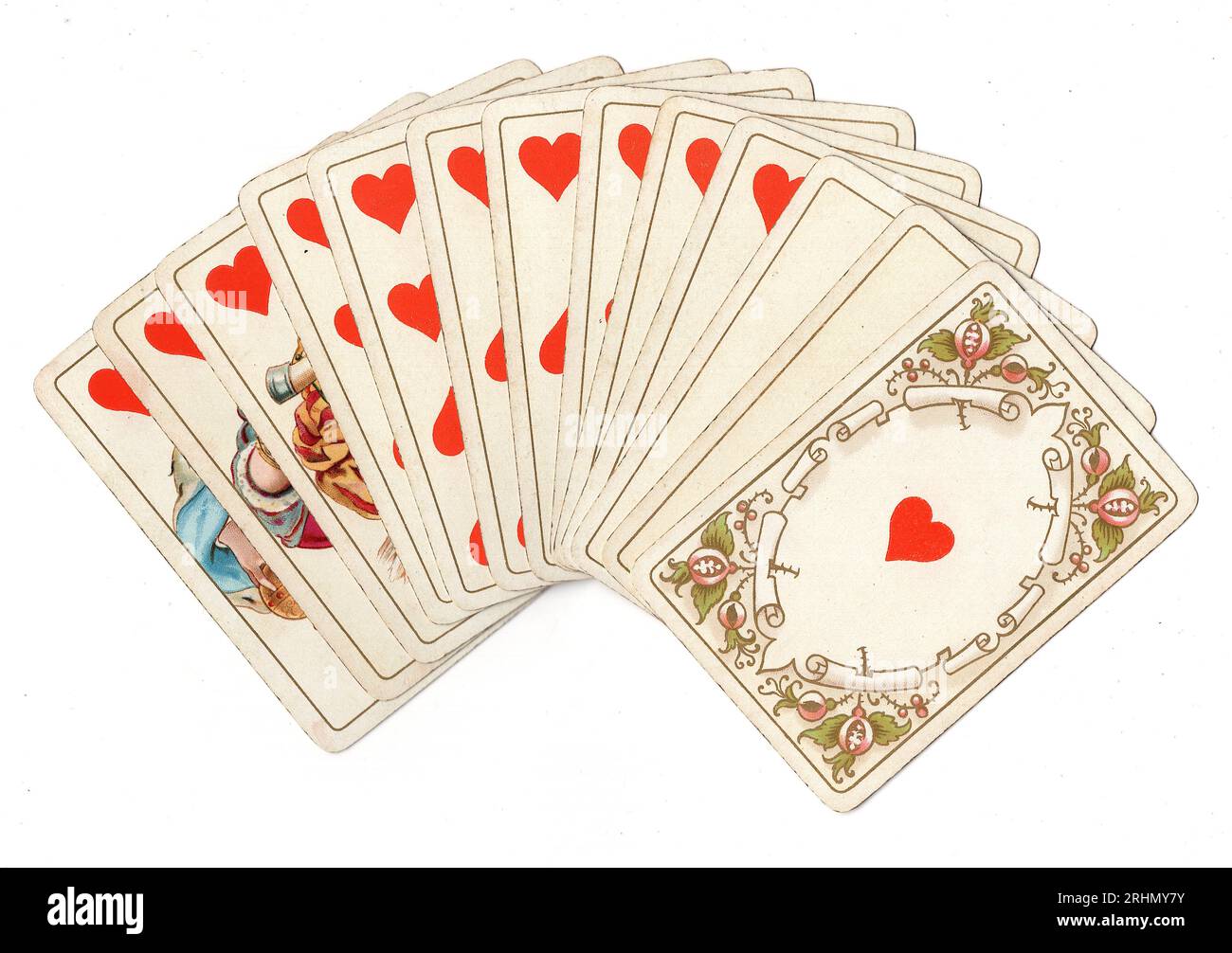 Antique playing cards featuring a full suit of hearts on a white ...