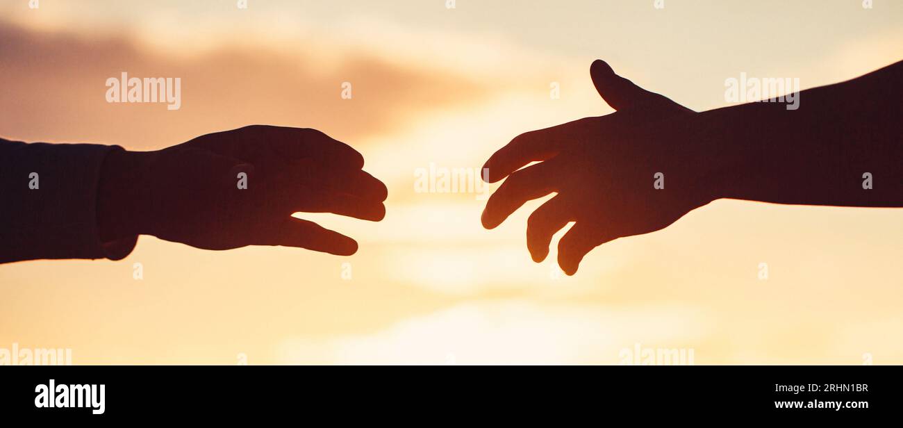 Giving helping hands holding together hi-res stock photography and ...