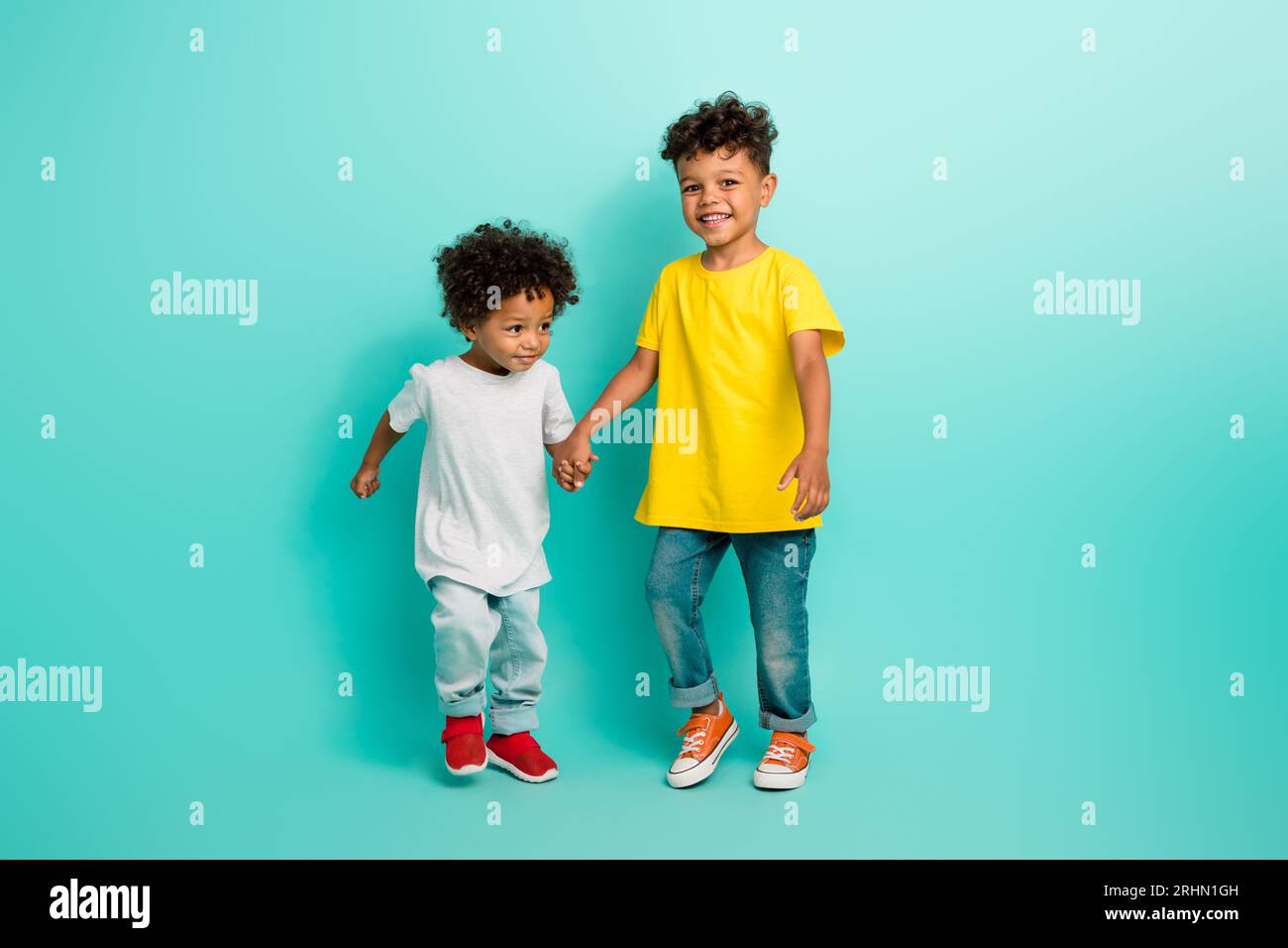 Full size photo of two adorable small boys friendly brothers hold hands ...