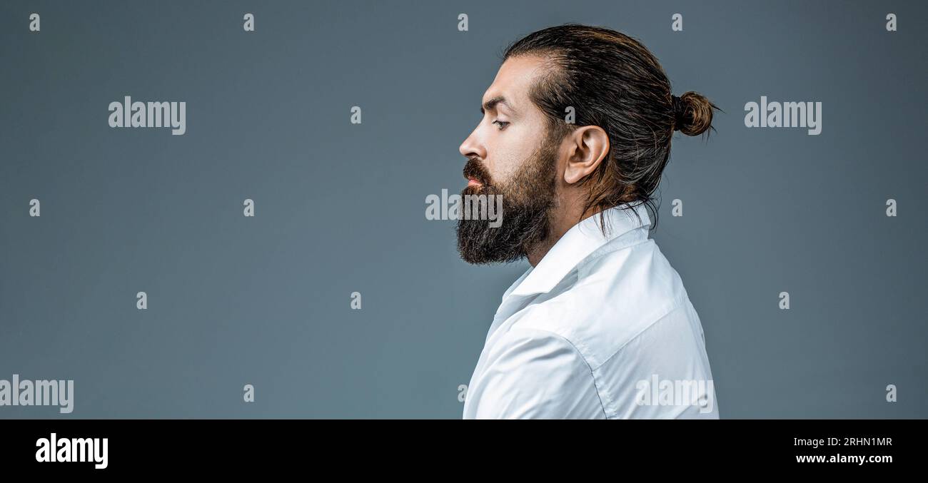 Side view bearded man isolated on gray background. Man's haircut in ...