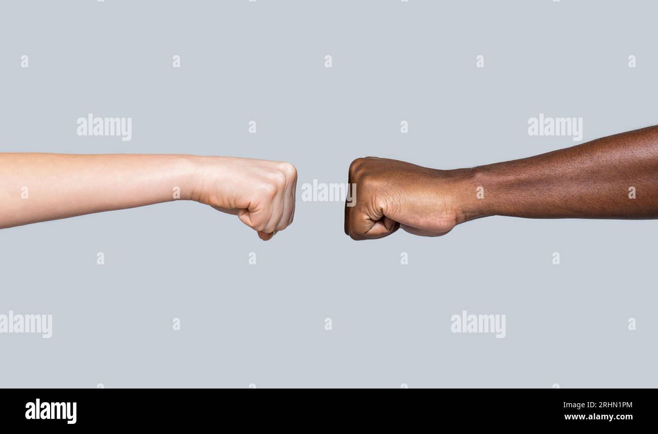 Friendship, team, good work. Multicultural friends giving fist bump to ...