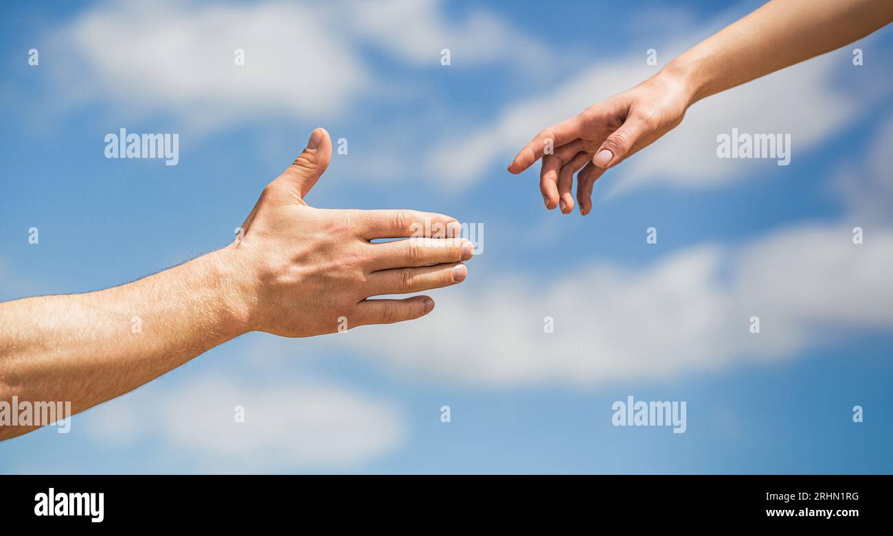 Hands man and woman reaching to each other, support. Giving a helping ...