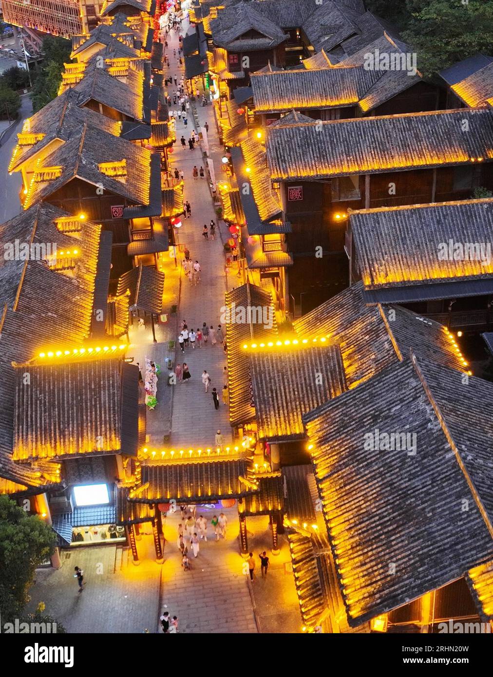 Aerial photo shows people enjoying the evening in Youzhou ancient town ...