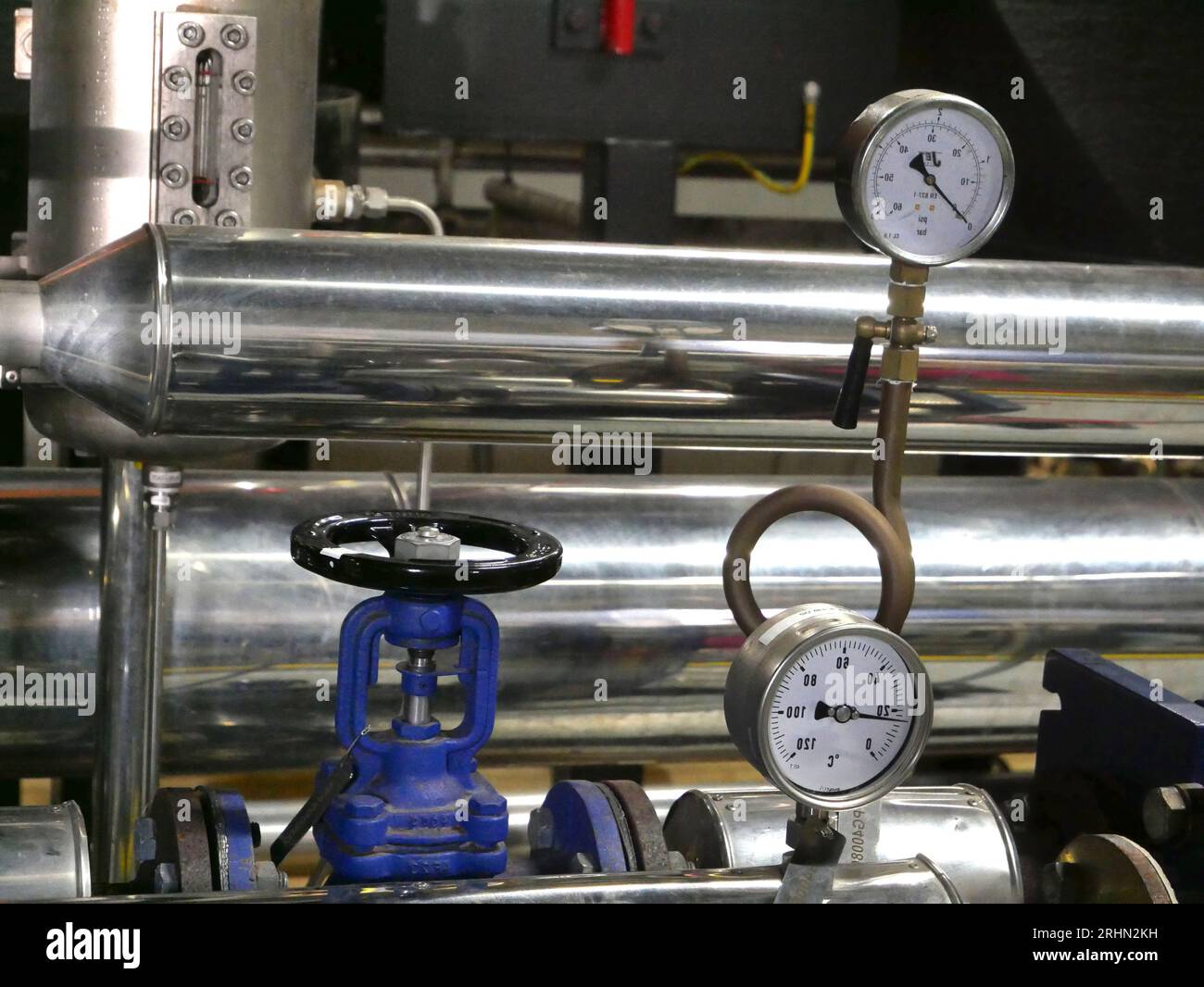 Industrial whiskey distiller construction, pipes and sensors, alcohol ...