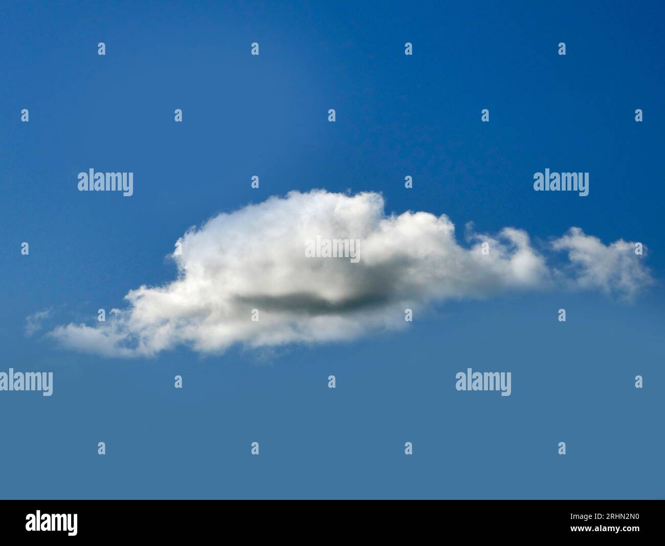 Single white cloud over blue sky background. Fluffy cumulus cloud shape ...