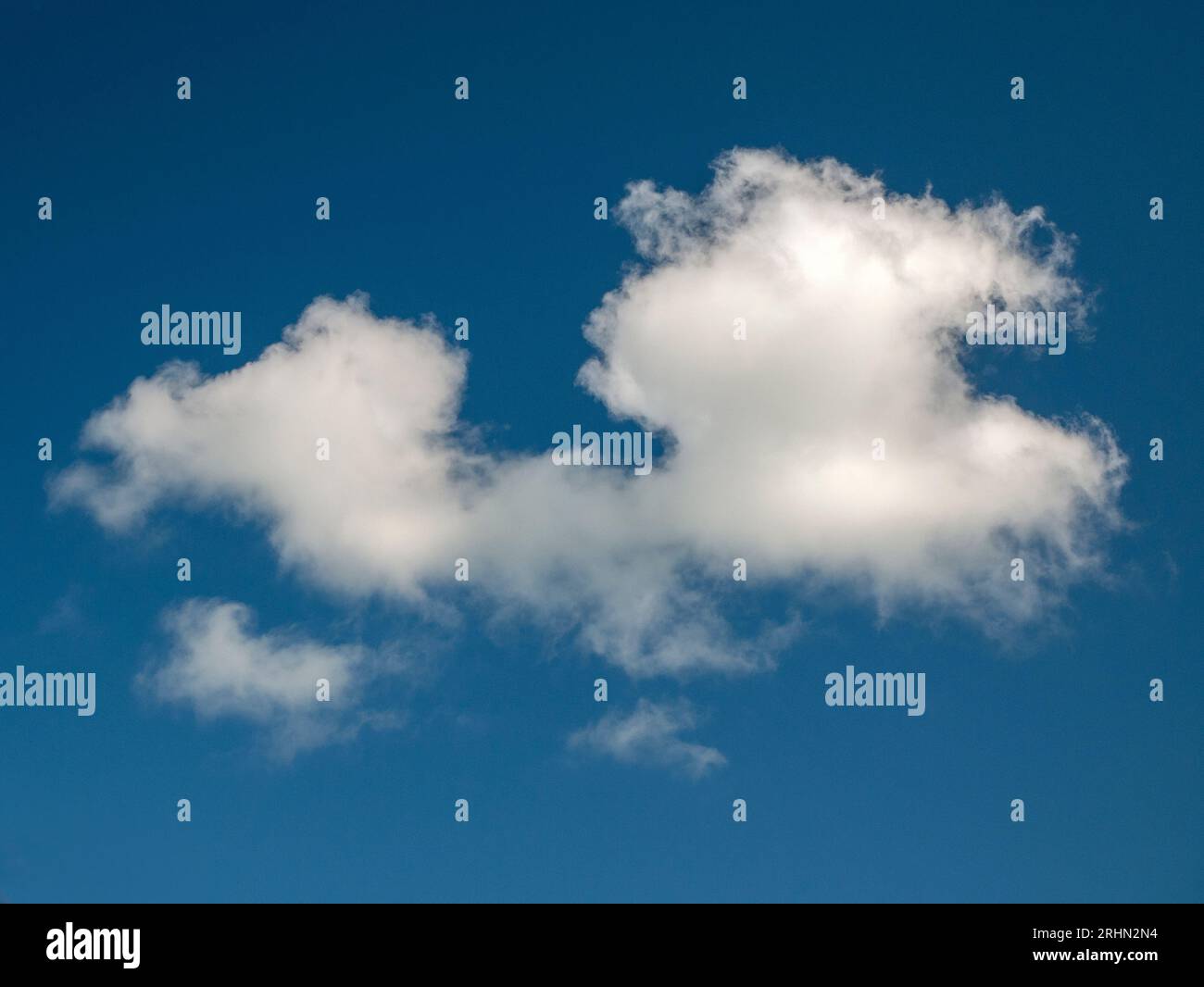Single white cloud over blue sky background. Fluffy cumulus cloud shape ...