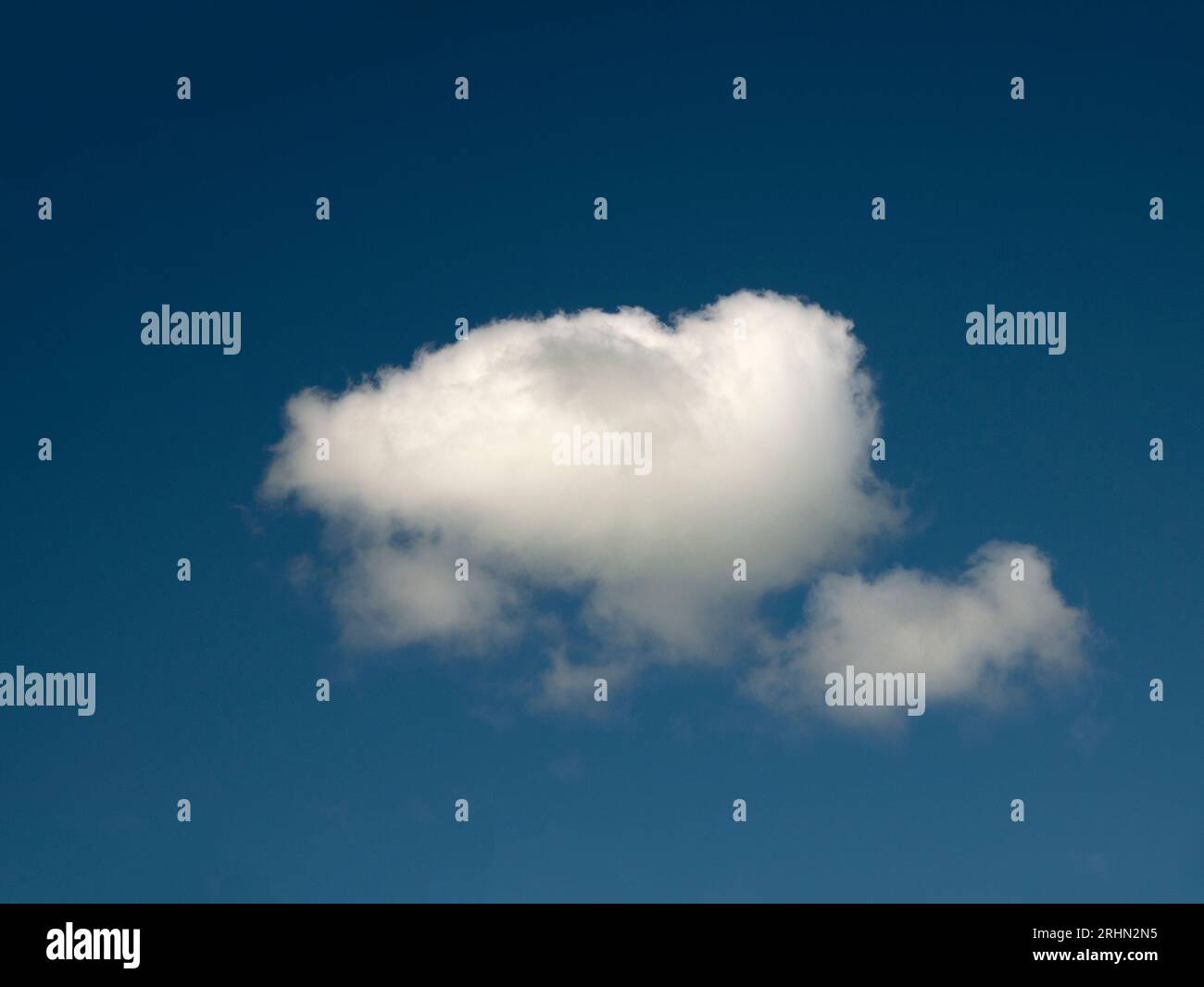 Single white cloud over blue sky background. Fluffy cumulus cloud shape ...