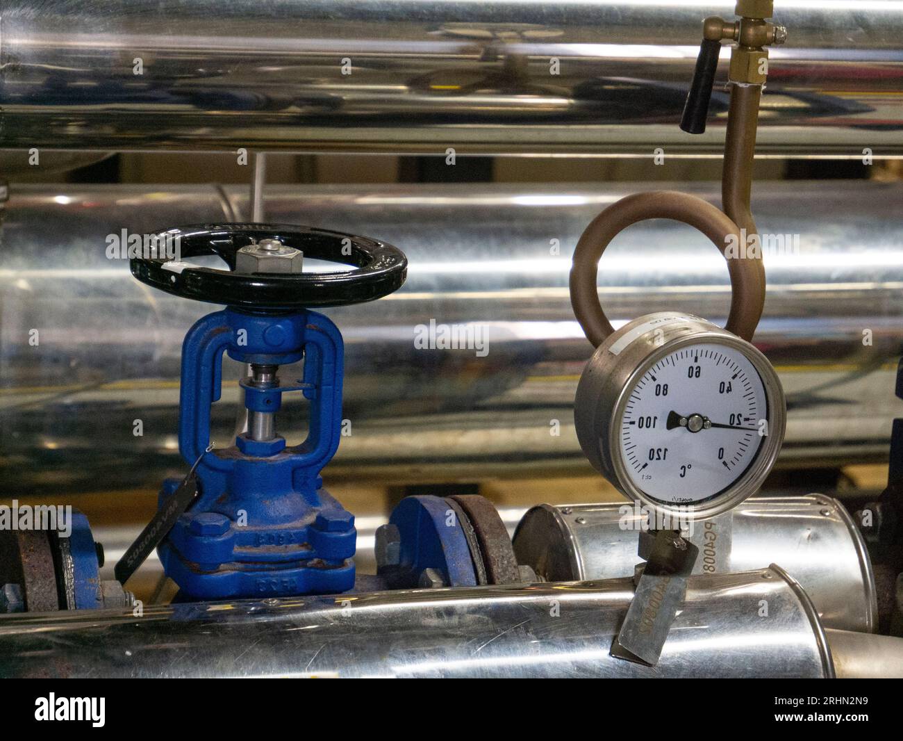 Industrial whiskey distiller construction, pipes and sensors, alcohol ...