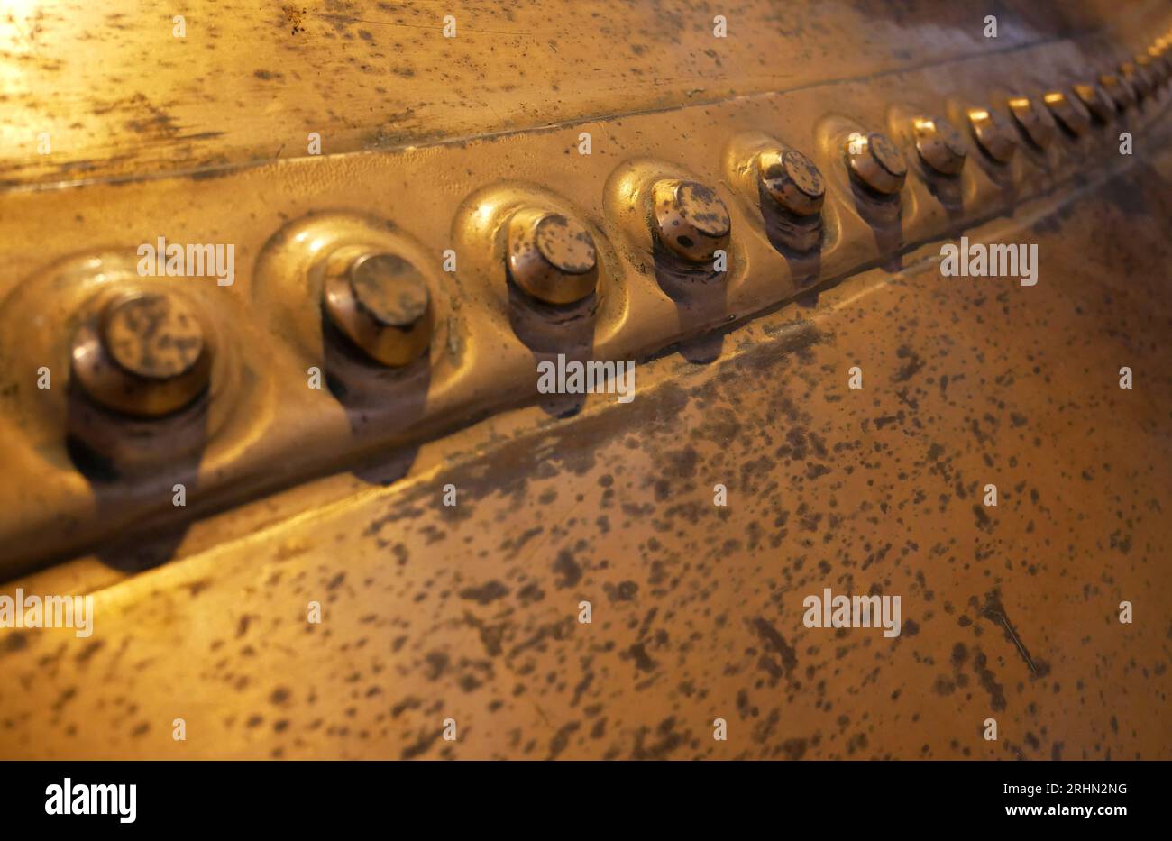 Metal background, old copper wall with rivets Stock Photo - Alamy