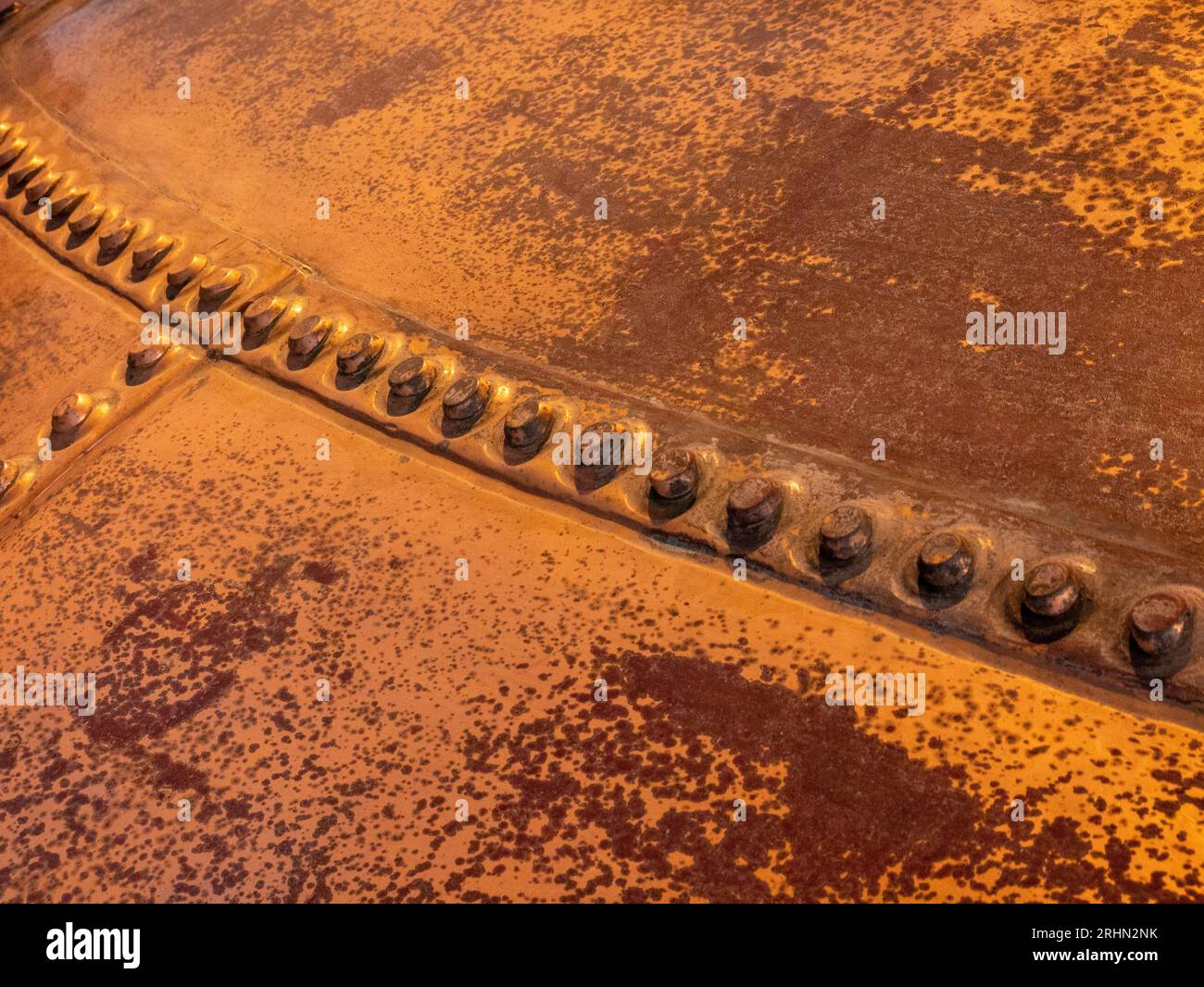 Metal background, old copper wall with rivets Stock Photo - Alamy