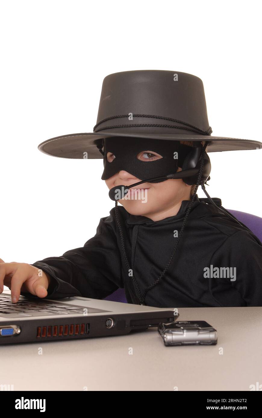 Young boy dressed as Zorro at helpdesk Stock Photo - Alamy