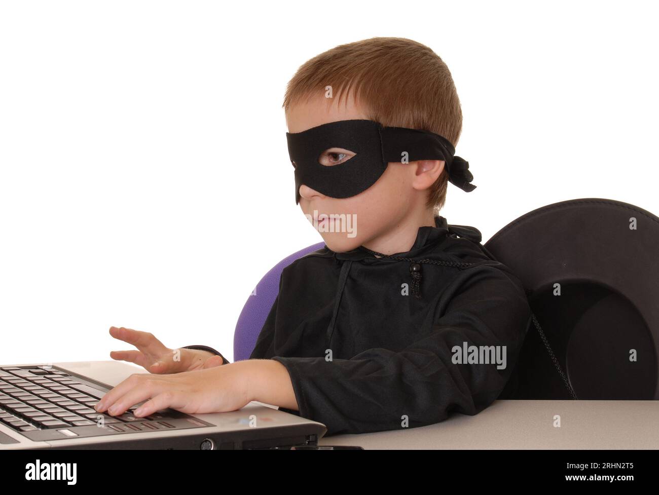 Young boy dressed as Zorro at helpdesk Stock Photo - Alamy