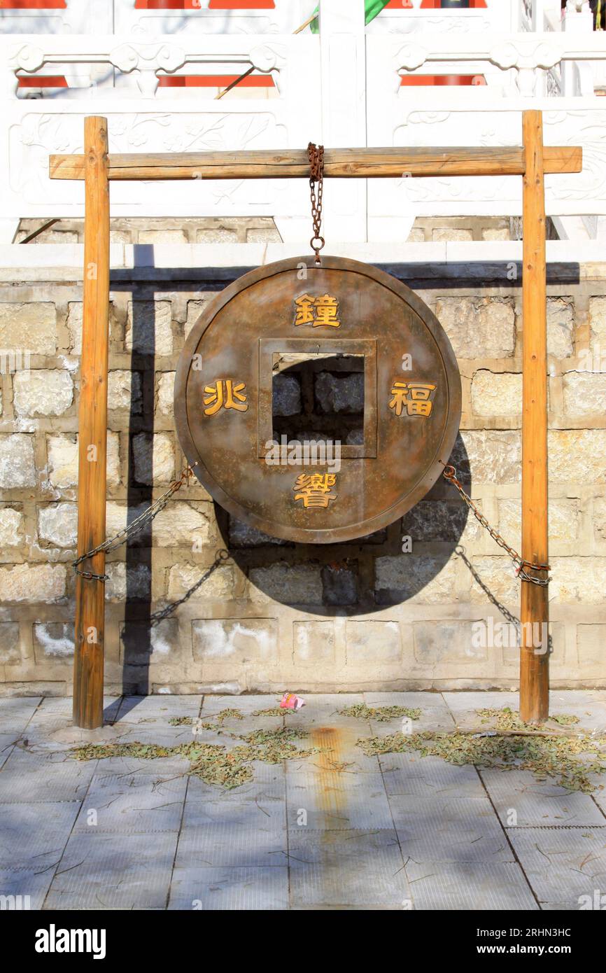 huge coins hanging on the wooden frame Stock Photo - Alamy