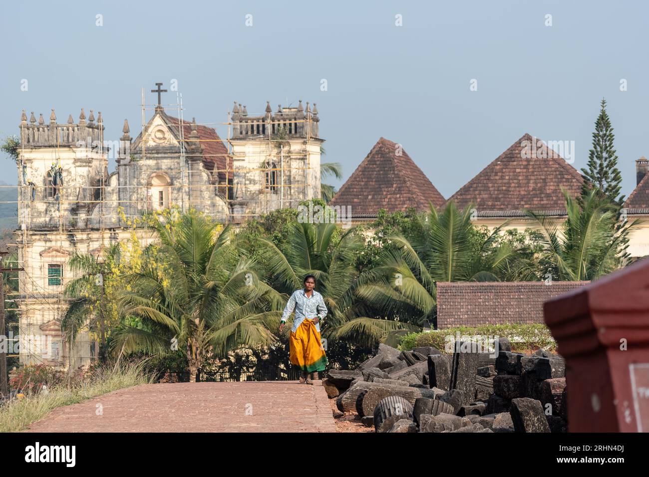 Old Goa, India - January 2023: An Indian woman walking in the Unesco ...