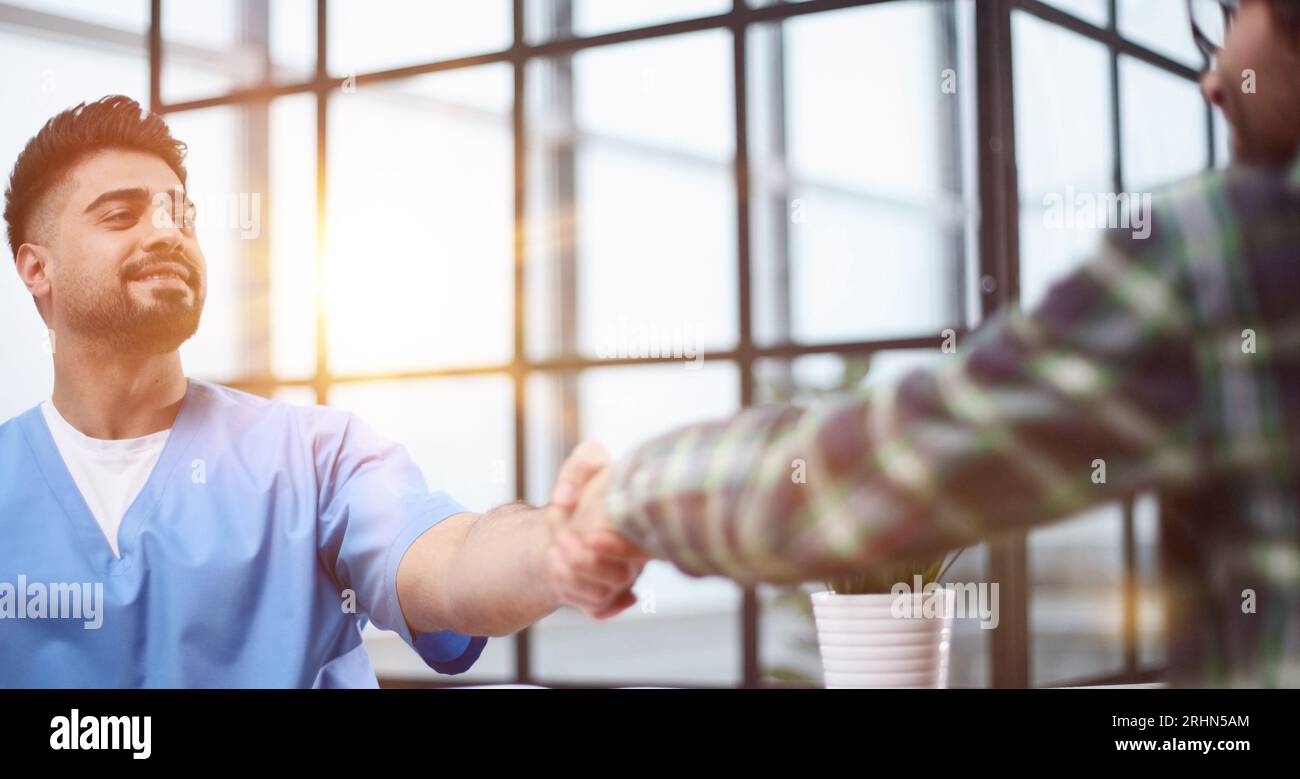 Happy doctor handshake nurse hi-res stock photography and images - Alamy