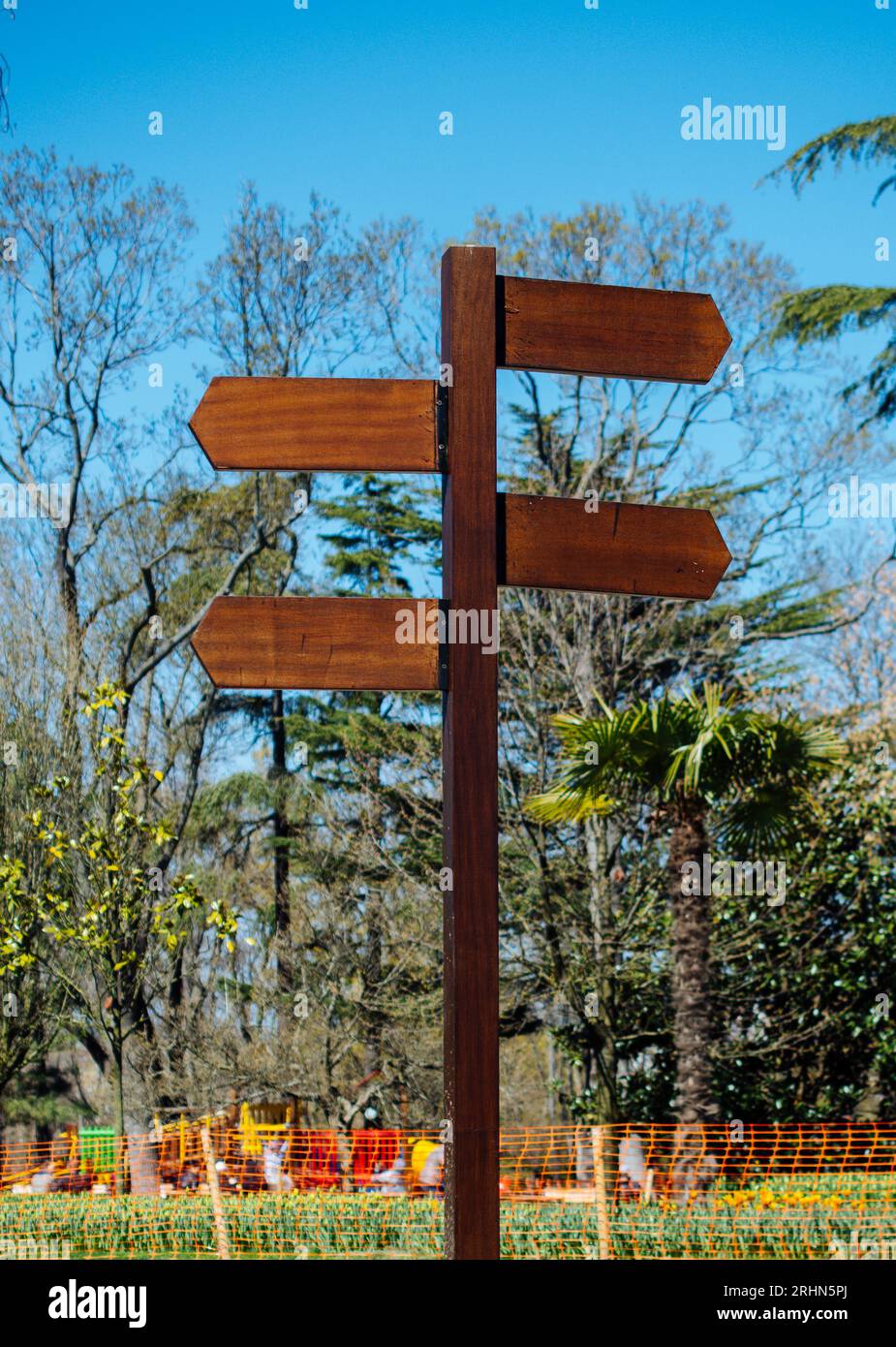 Wooden post for road signs. Double direction Stock Photo - Alamy
