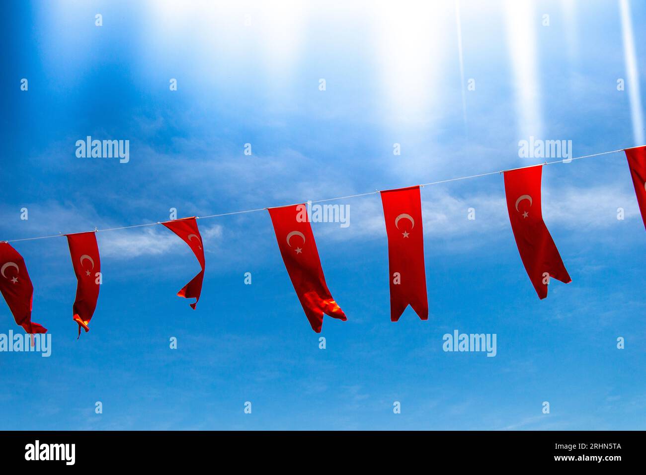 Flags with clouds and blue sky background hi-res stock photography and ...