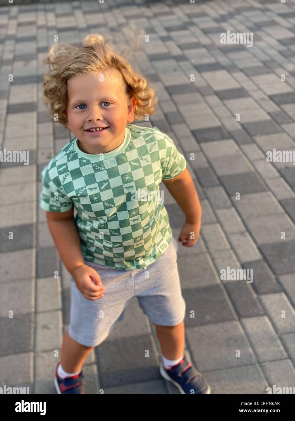 Curly boy looking camera hi-res stock photography and images - Alamy
