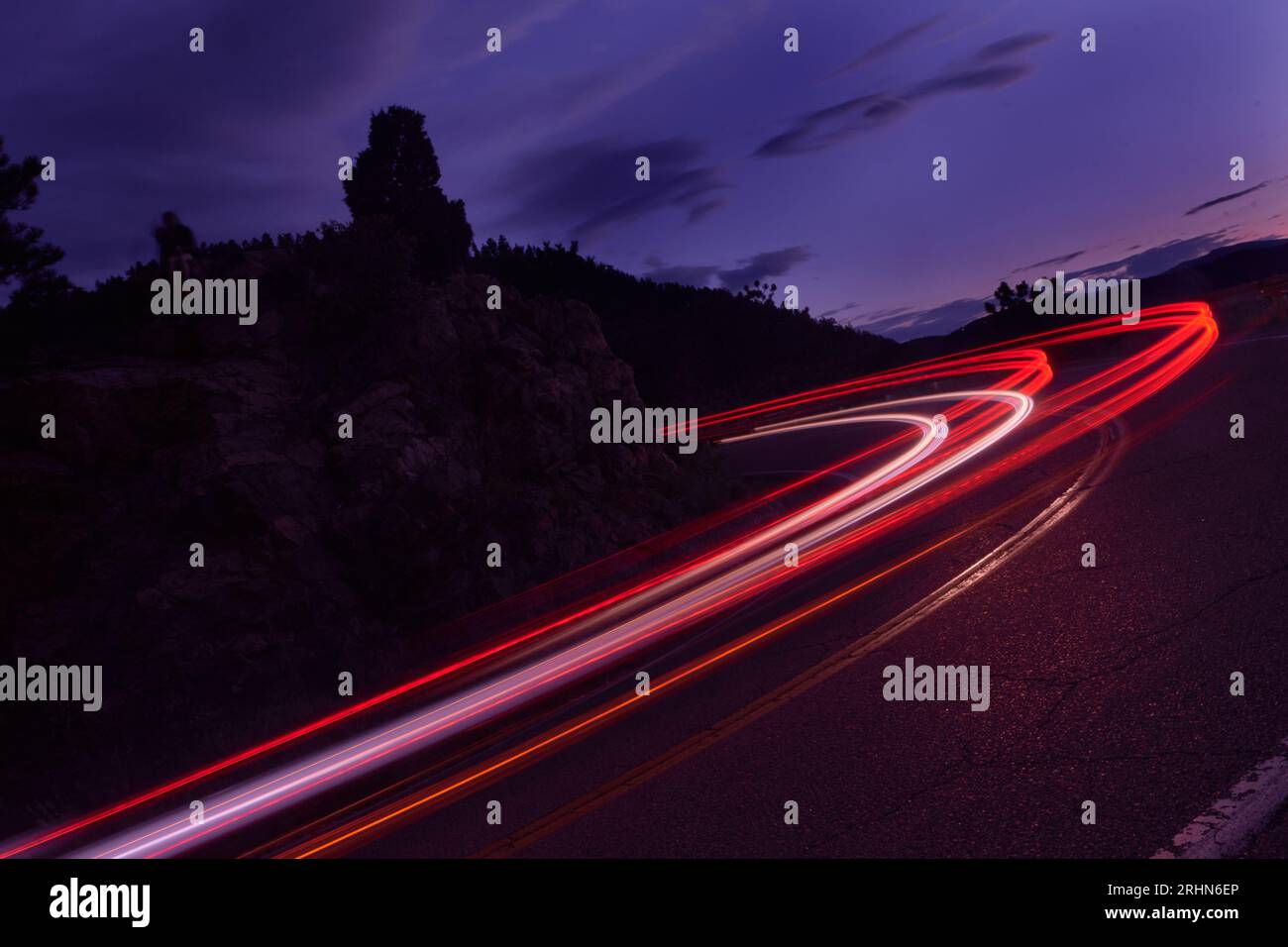 Traffic streaking on mountain roadway, Lariat Trail, Colorado Stock ...