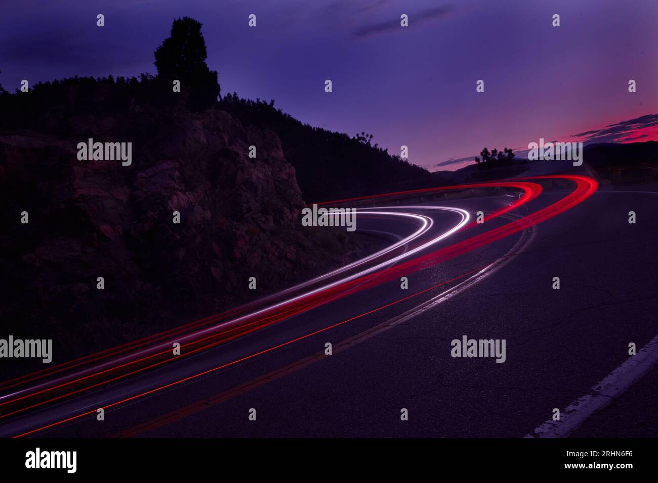 Traffic streaking on mountain roadway, Lariat Trail, Colorado Stock ...