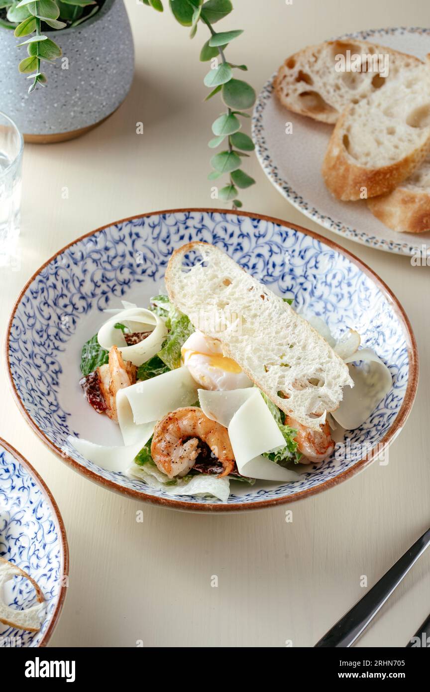 caesar salad with shrimp. restaurant menu Stock Photo - Alamy