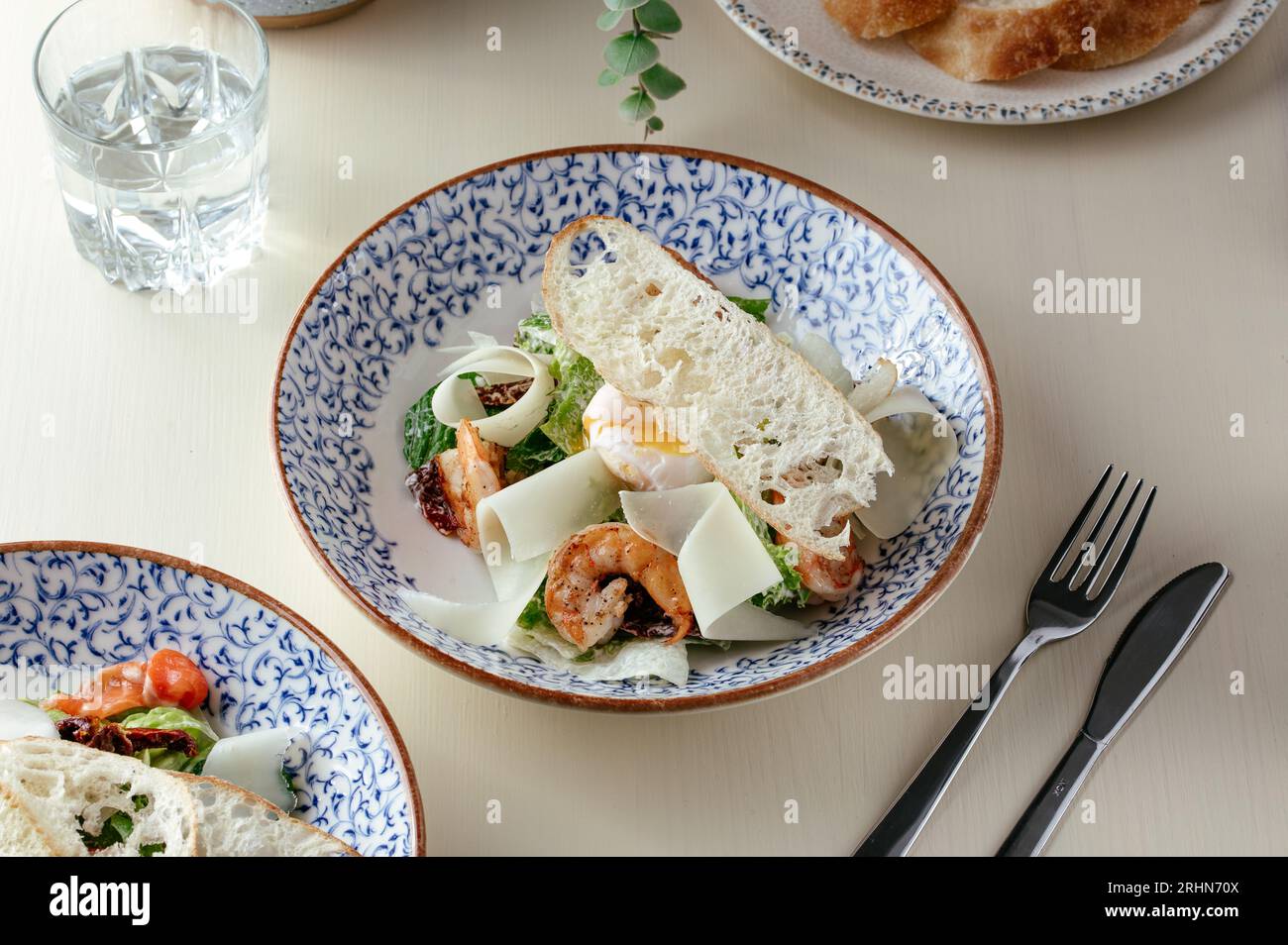 caesar salad with shrimp. restaurant menu Stock Photo - Alamy