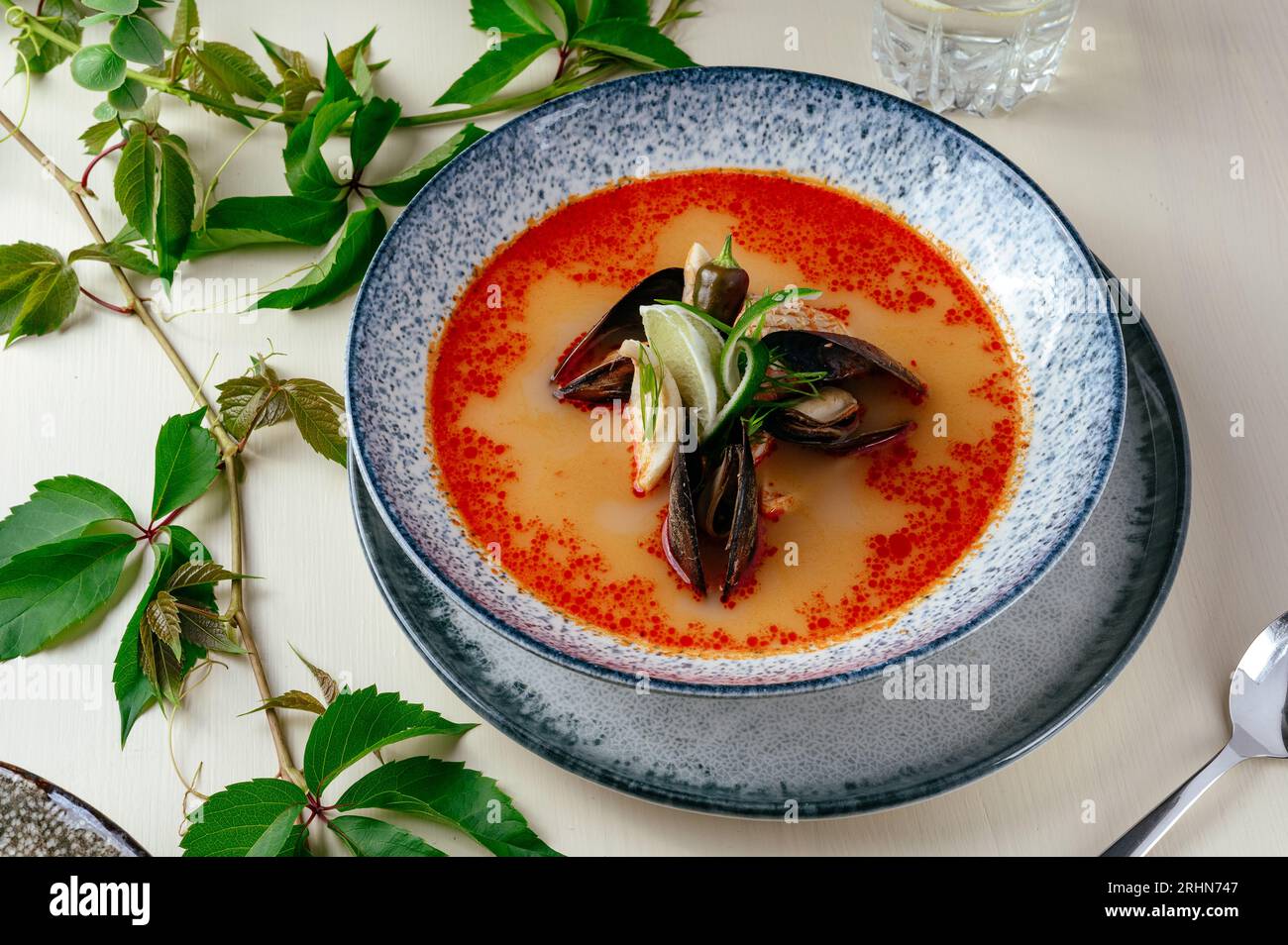 asian tom yam soup with shrimp and mussels. restaurant menu Stock Photo ...