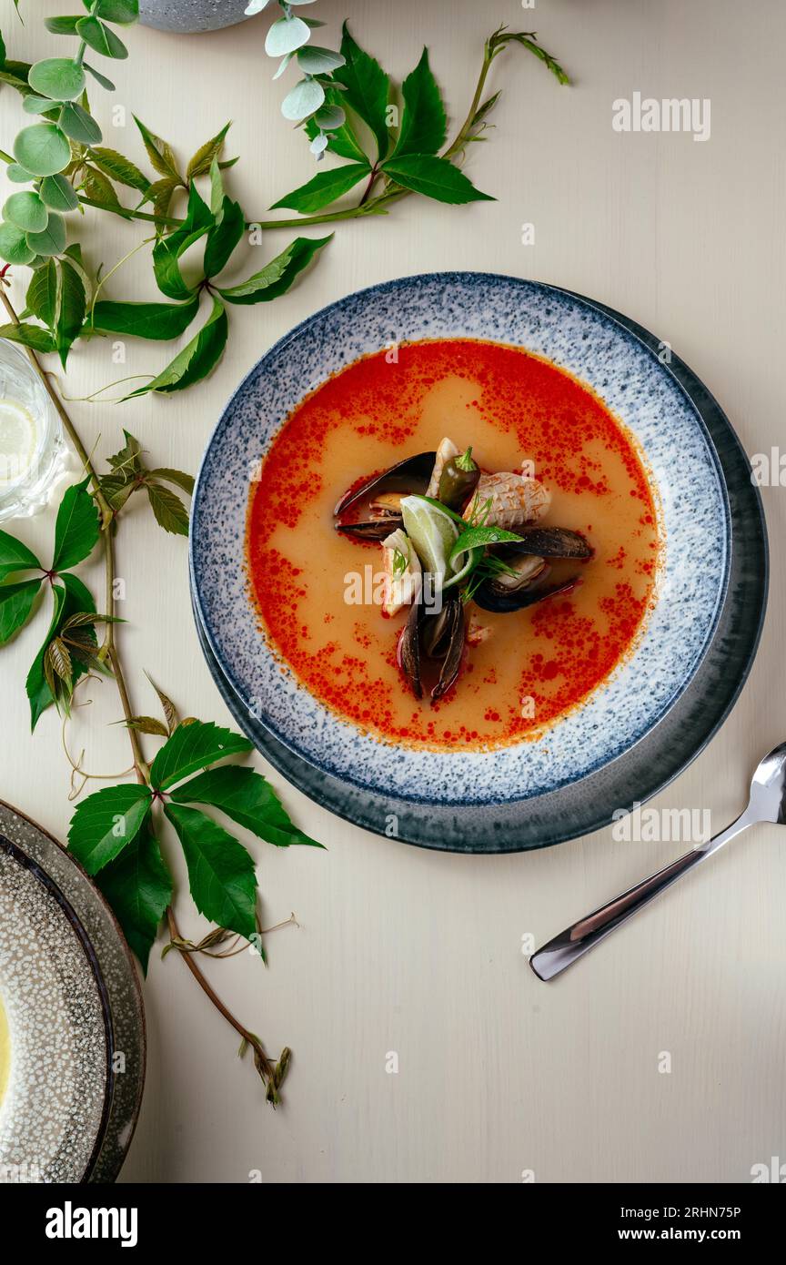asian tom yam soup with shrimp and mussels. restaurant menu Stock Photo ...