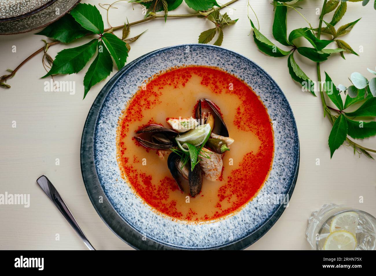 asian tom yam soup with shrimp and mussels. restaurant menu Stock Photo ...