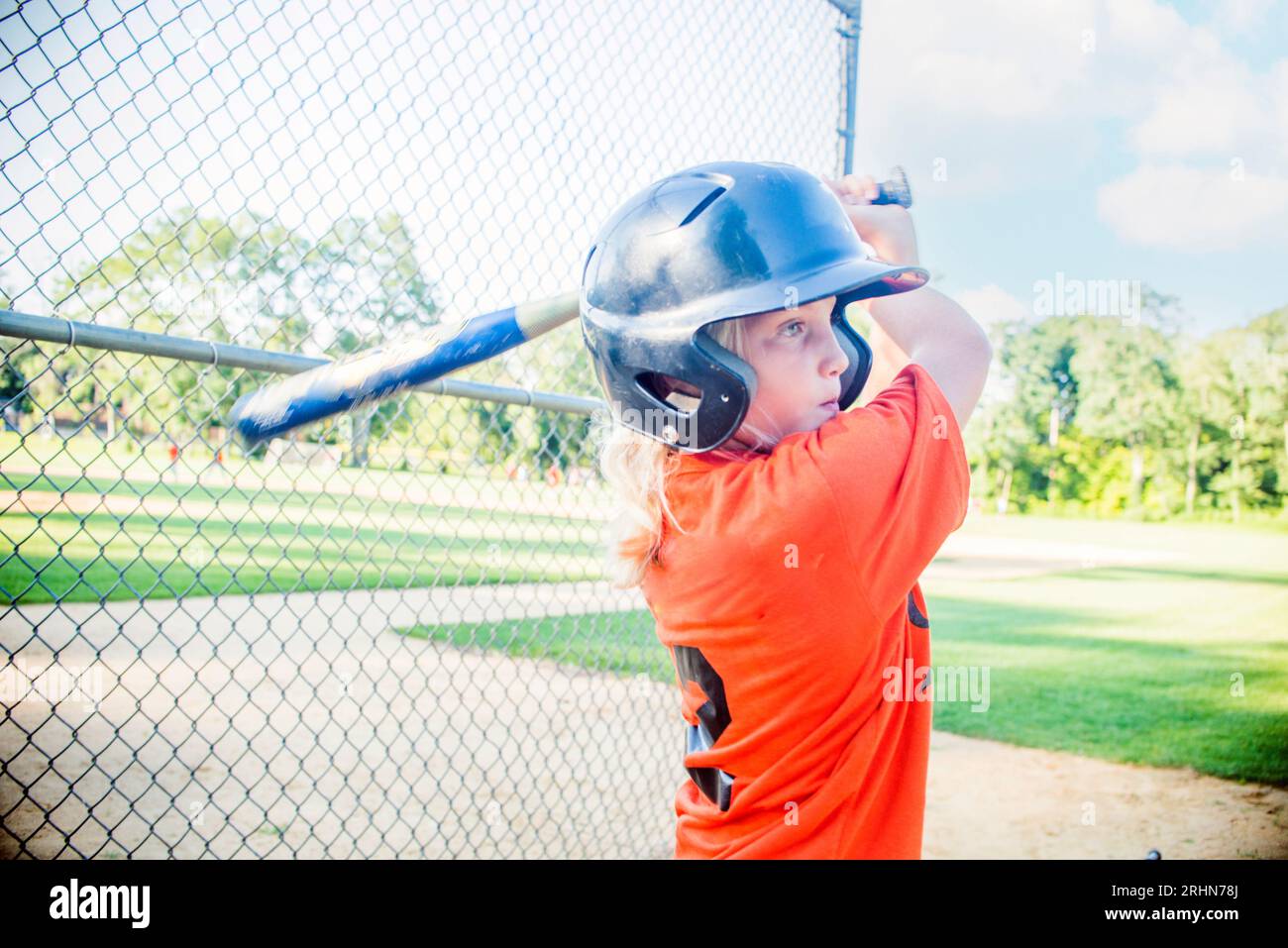 10 year old girl the batter on the little league team Stock Photo - Alamy