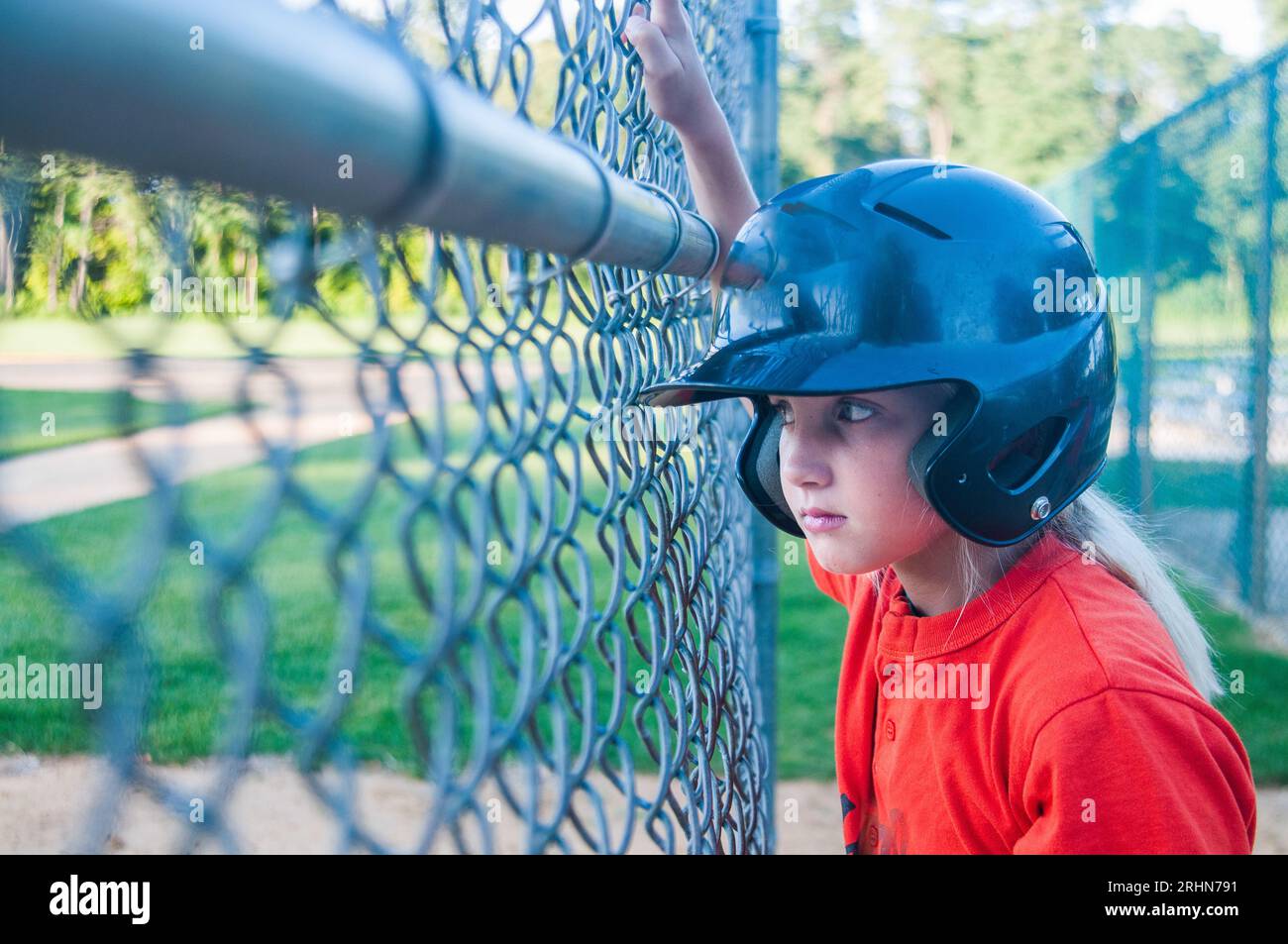 10 year old girl the batter on the little league team Stock Photo - Alamy